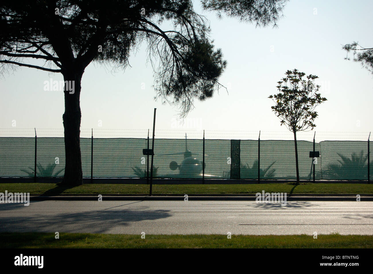 A creative shot of a private jet sits on the runway at Nice Airport ...