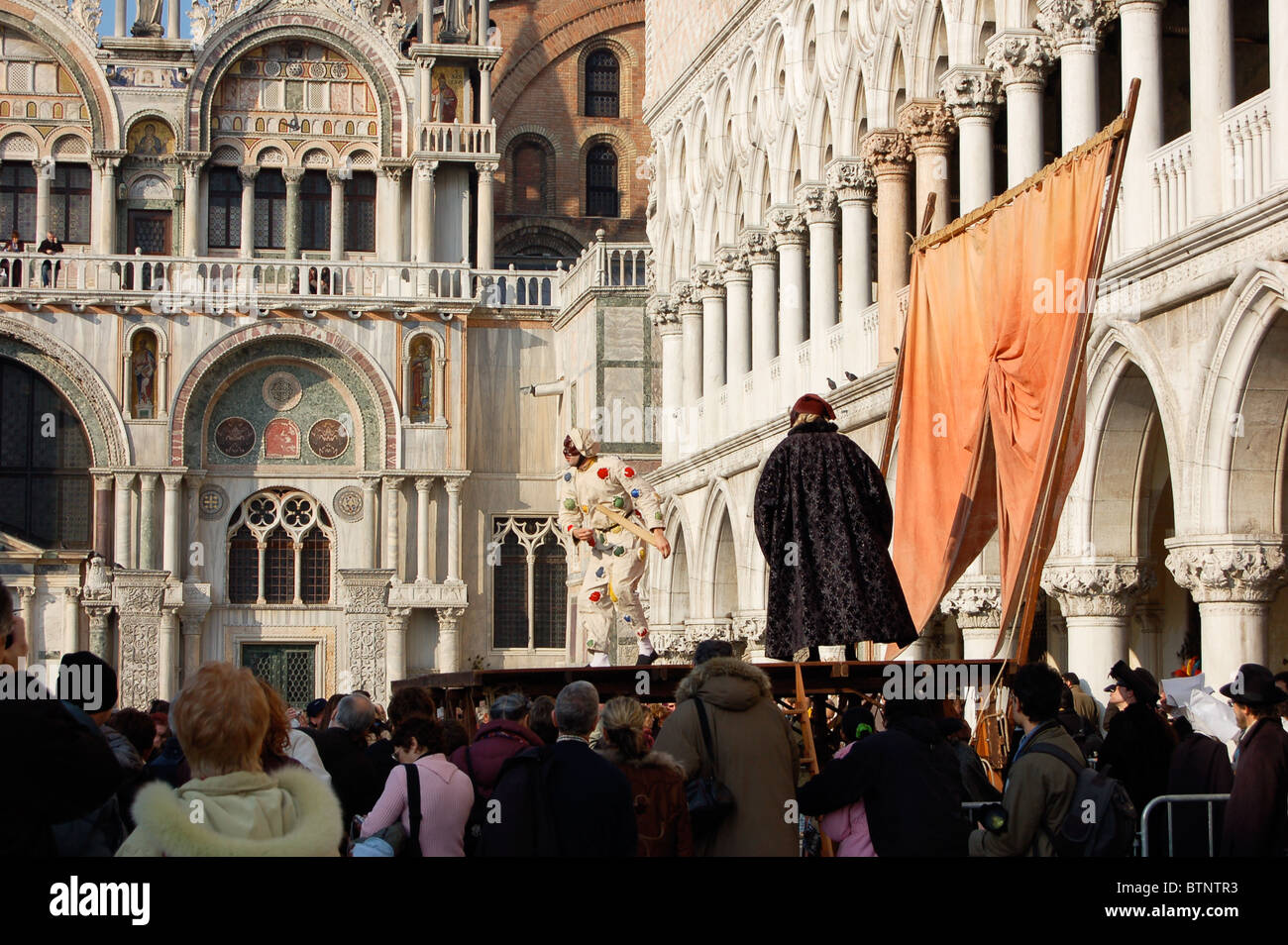 Carnival masked actors / players perform a scene from a play in St Mark ...