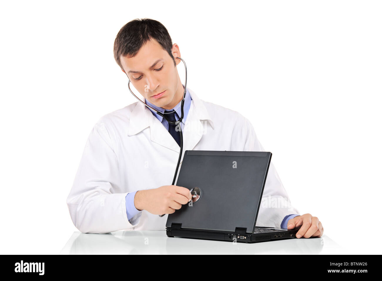 PC doctor examining a laptop computer Stock Photo - Alamy