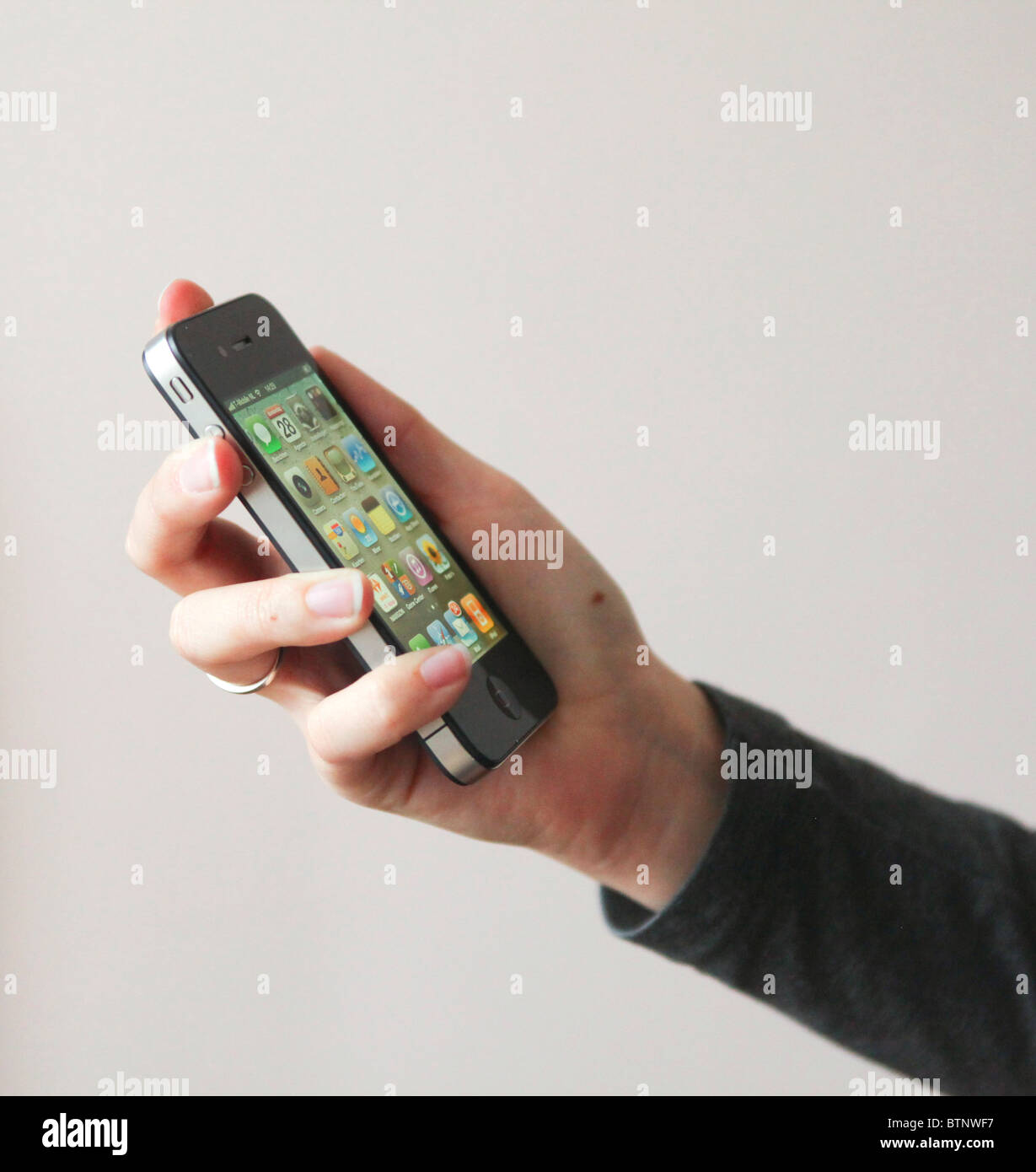 Female hand with Iphone and apps Stock Photo - Alamy