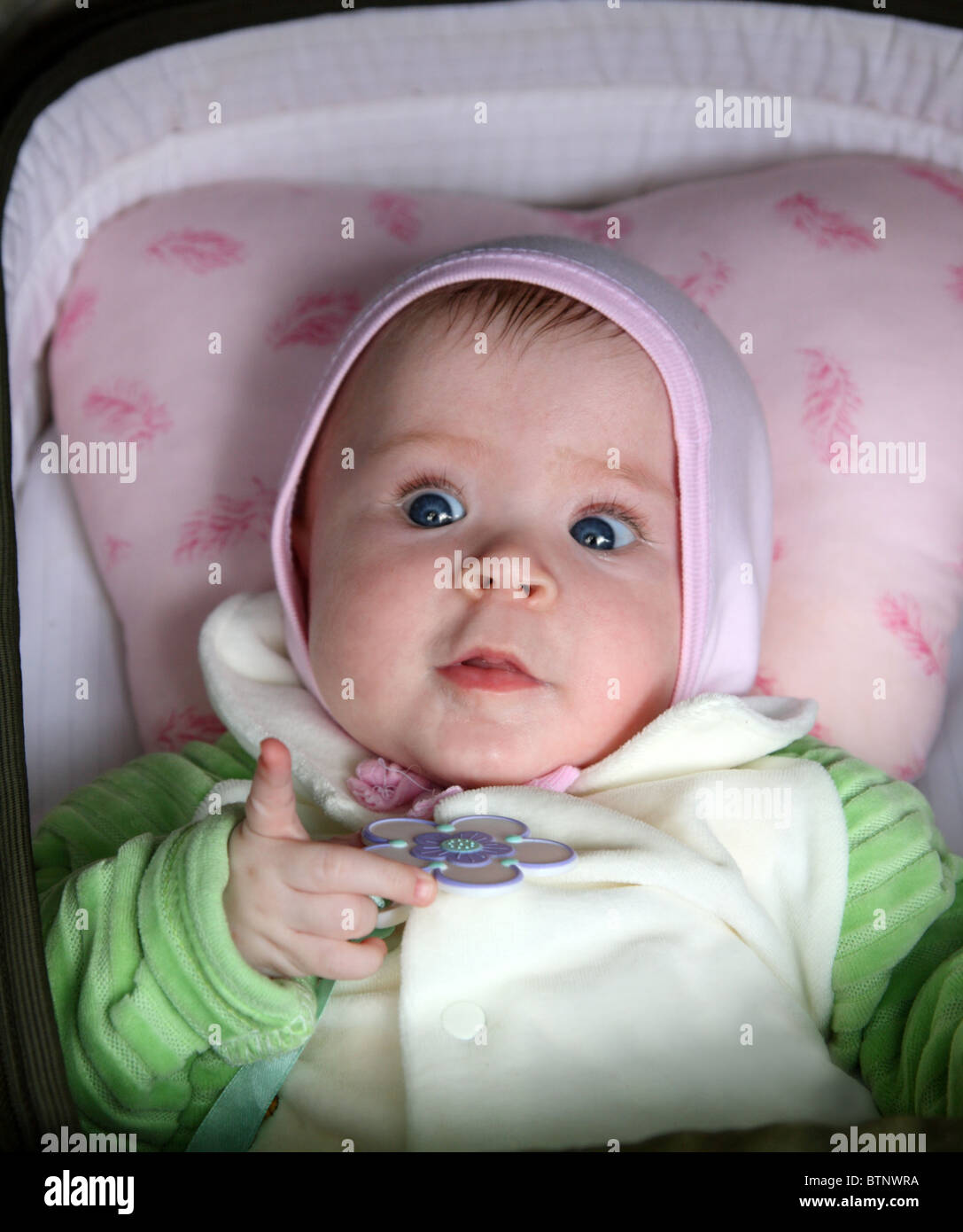 newborn baby portrait lying in pink cap Stock Photo - Alamy