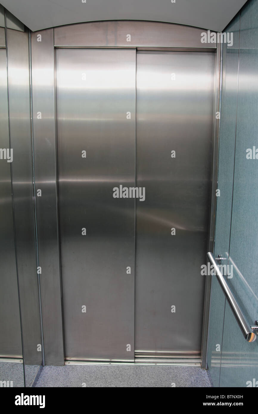 empty contemporary elevator interior with steel doors Stock Photo - Alamy
