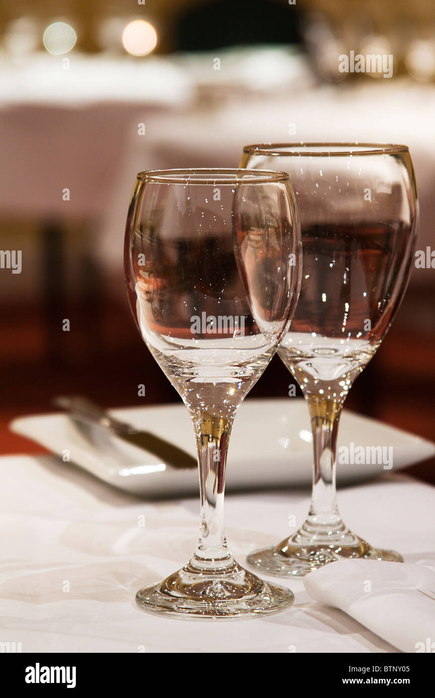 wine glasses on a table set for dinner Stock Photo - Alamy