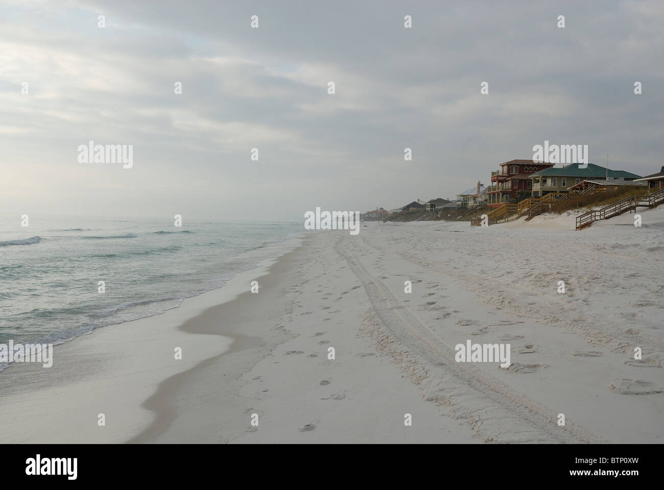 Florida beach scene with incoming tide waters and beach front homes ...