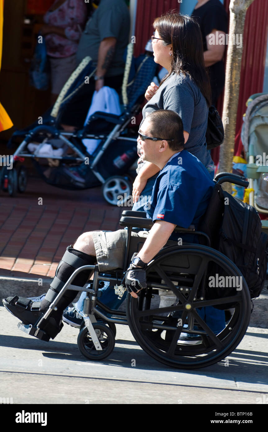 Disabled adult sitting in a wheelchair Stock Photo - Alamy