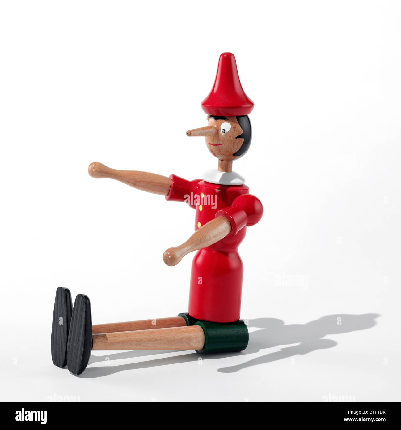 wood pinocchio on a white background Stock Photo - Alamy