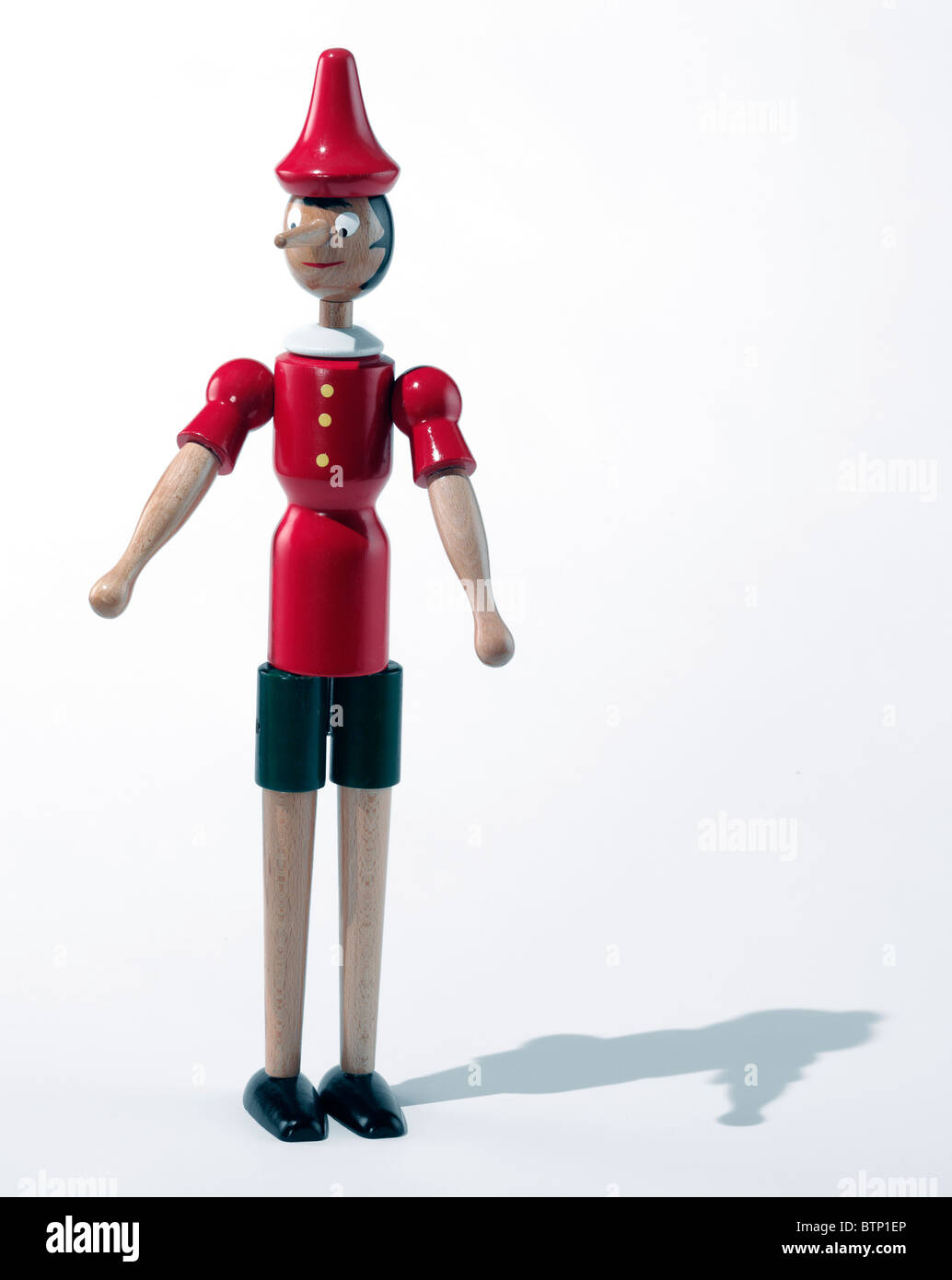 wood pinocchio on a white background Stock Photo - Alamy
