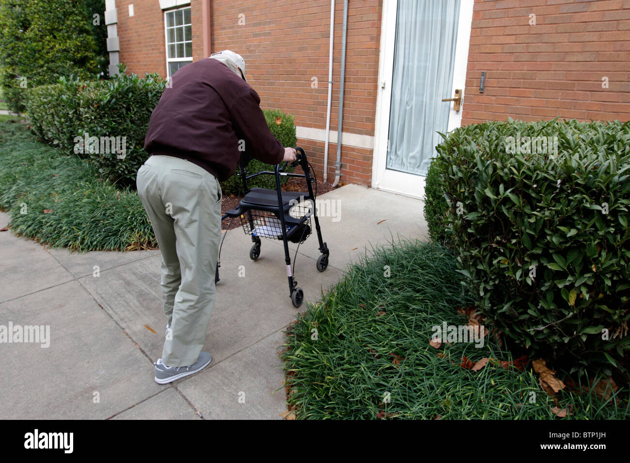 Old man using walker hi-res stock photography and images - Alamy