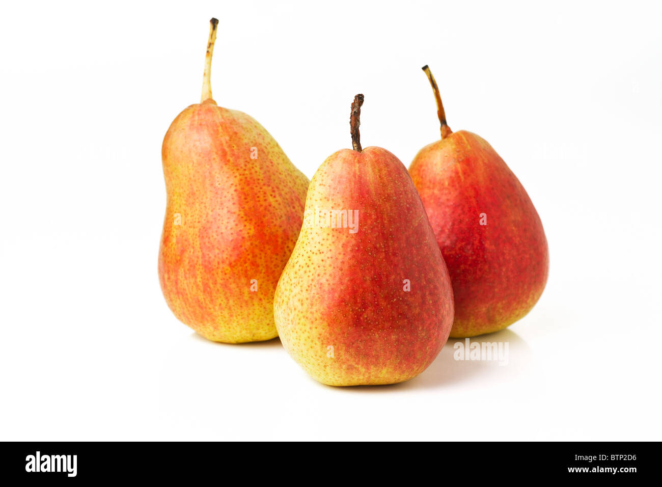 Three whole pears Stock Photo - Alamy