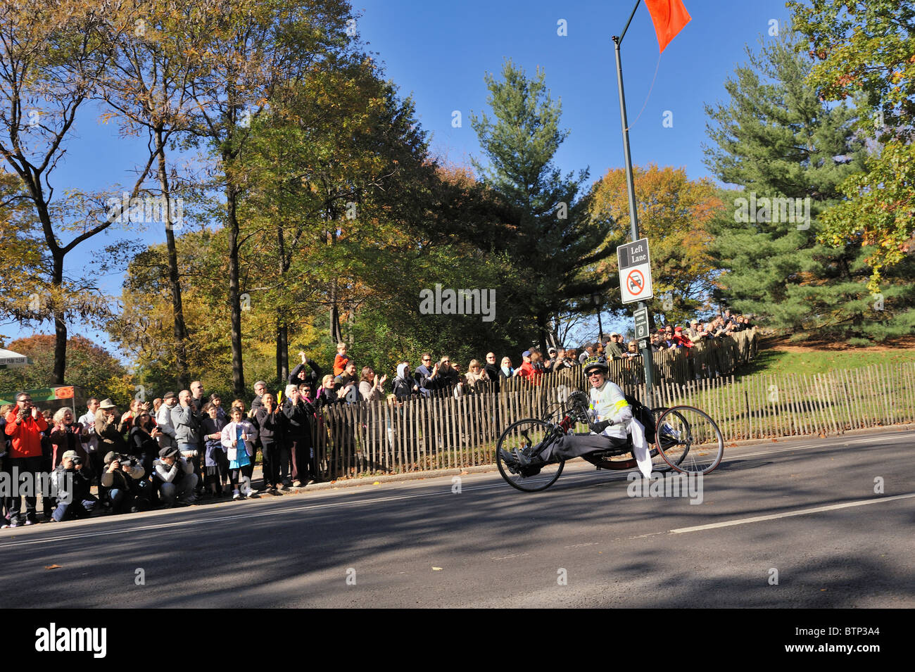 New York-Nov 7: Female hand cyclist smiles at cheering crowd watching ...