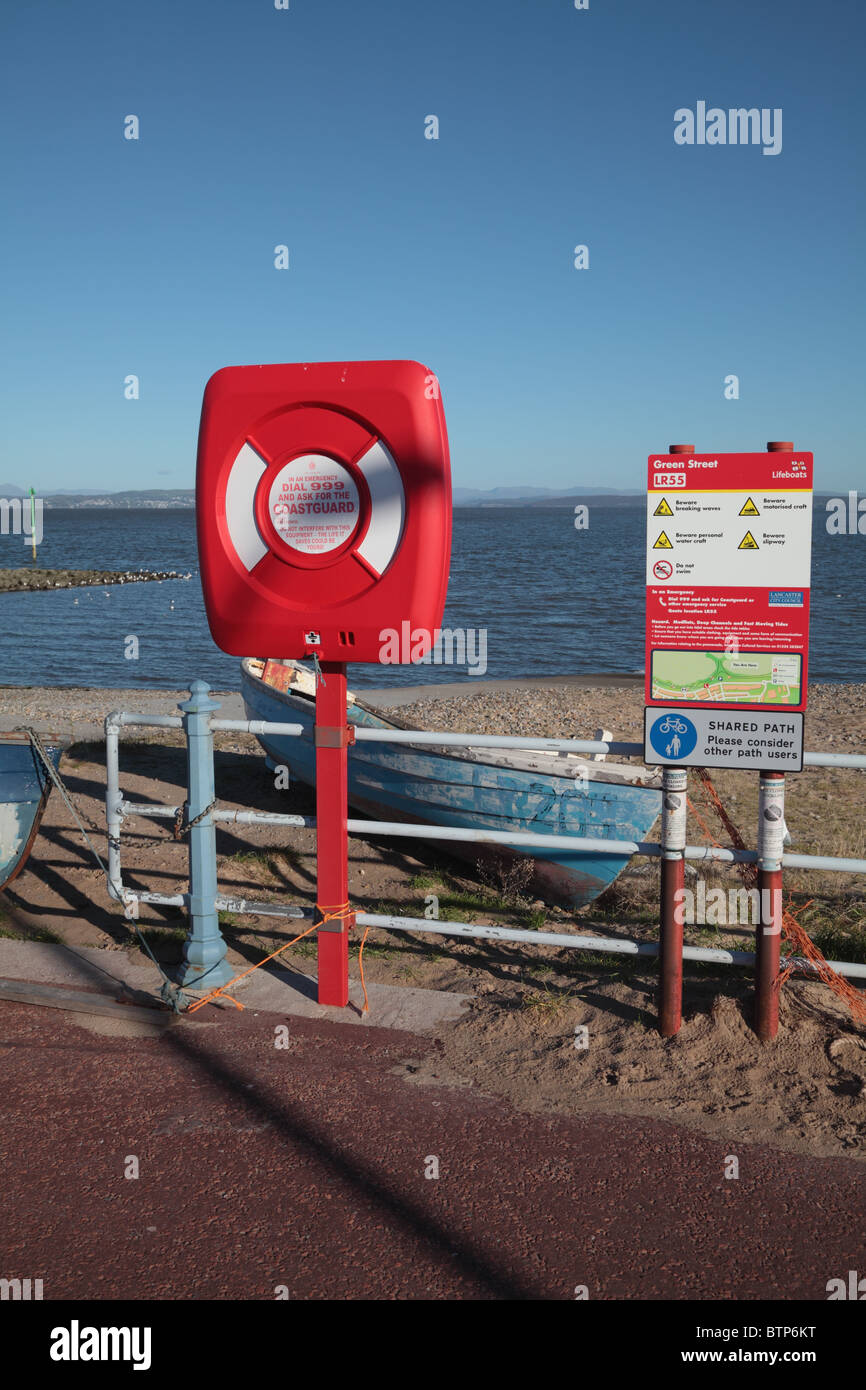 Life belt and tidal warnings sign on promenade sea front Stock Photo ...