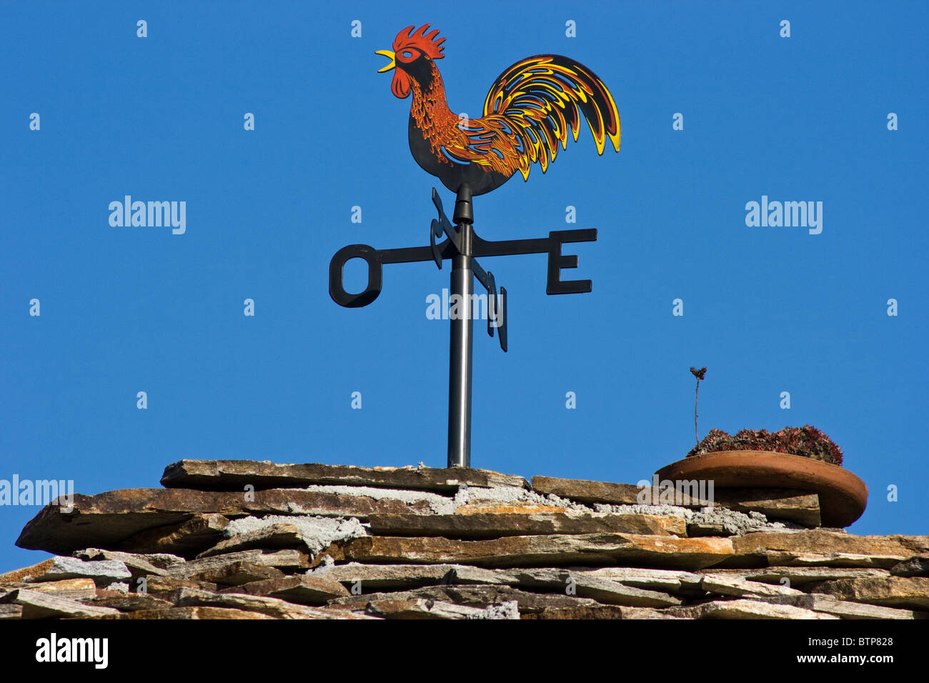 Dolen village, a detail from the tiled roof with weather-cock, Balkans ...