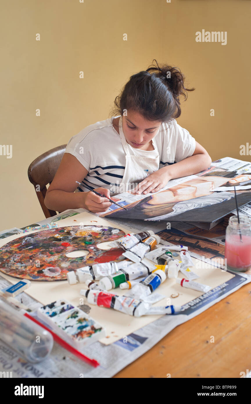 Teenager engaged with detailed art work Stock Photo - Alamy