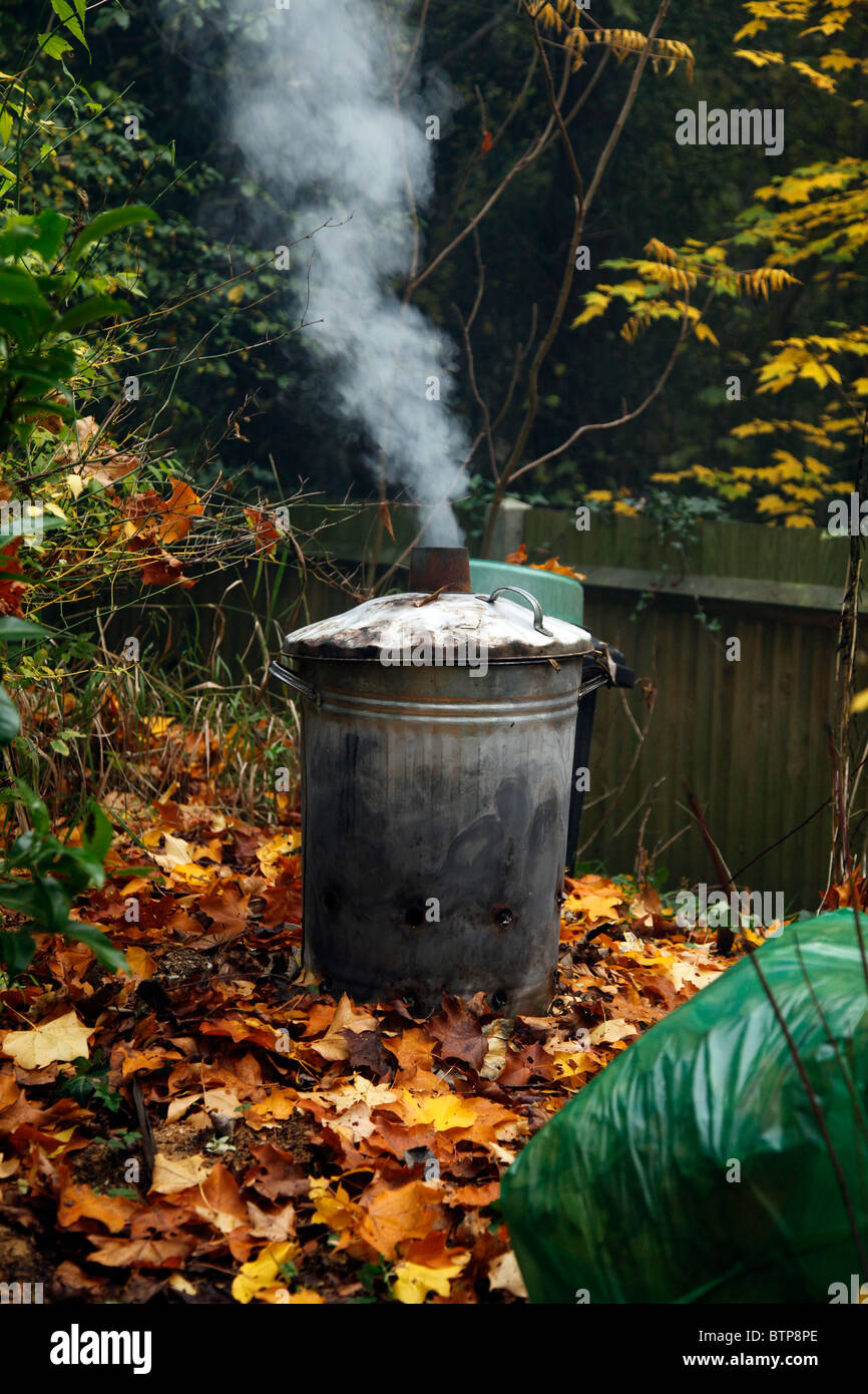 Burning the leaves in autumn Stock Photo - Alamy