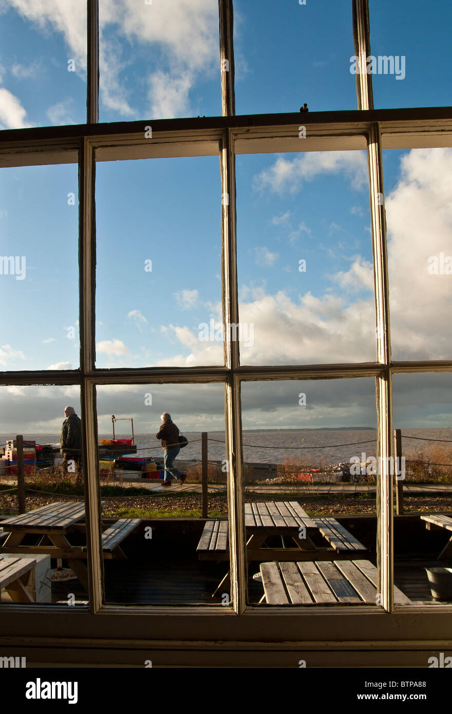 Whitstable Harbour at dusk through window Stock Photo - Alamy