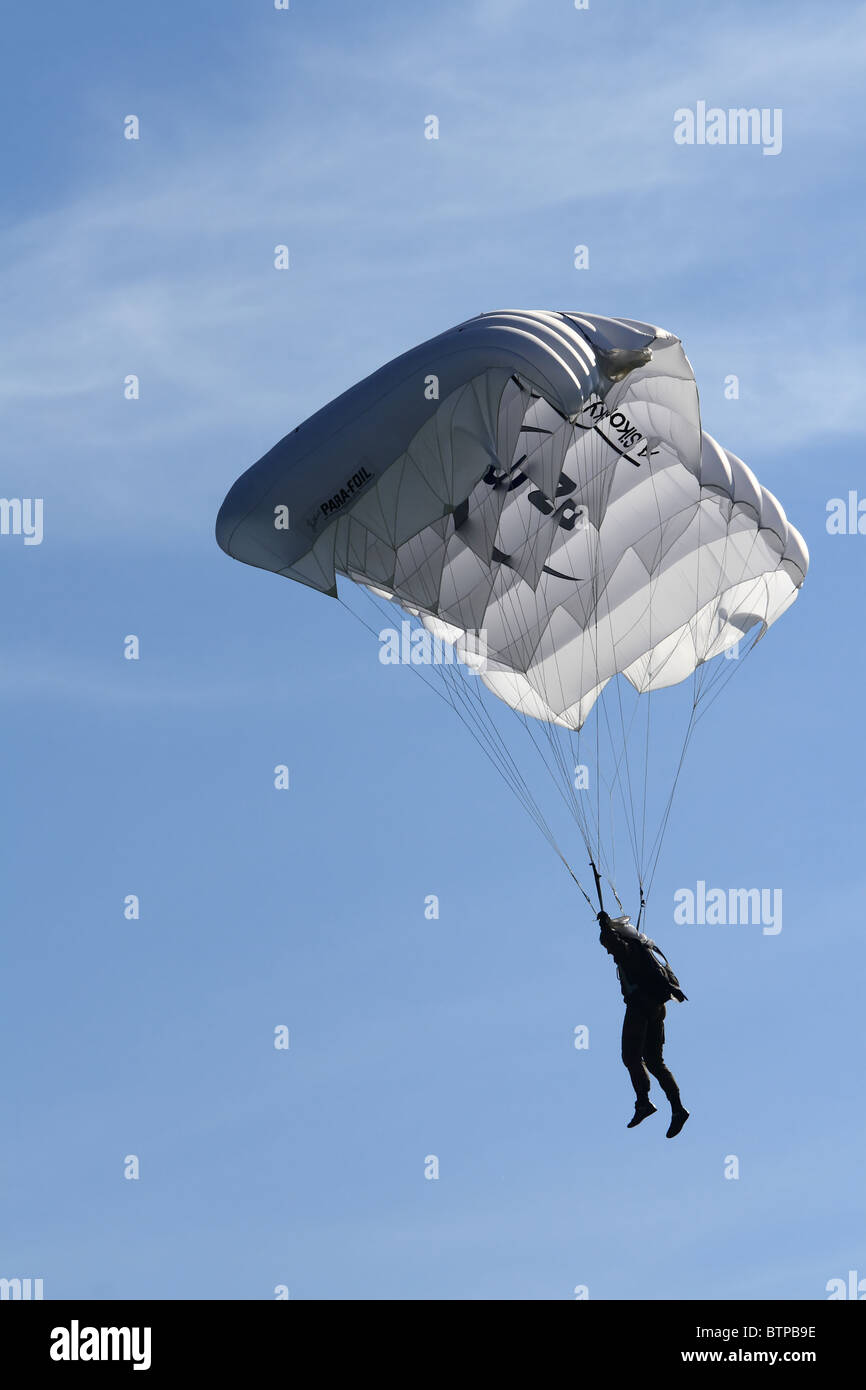 Parachute on a bright blue sky. Training of paragliders. Sport airfield ...