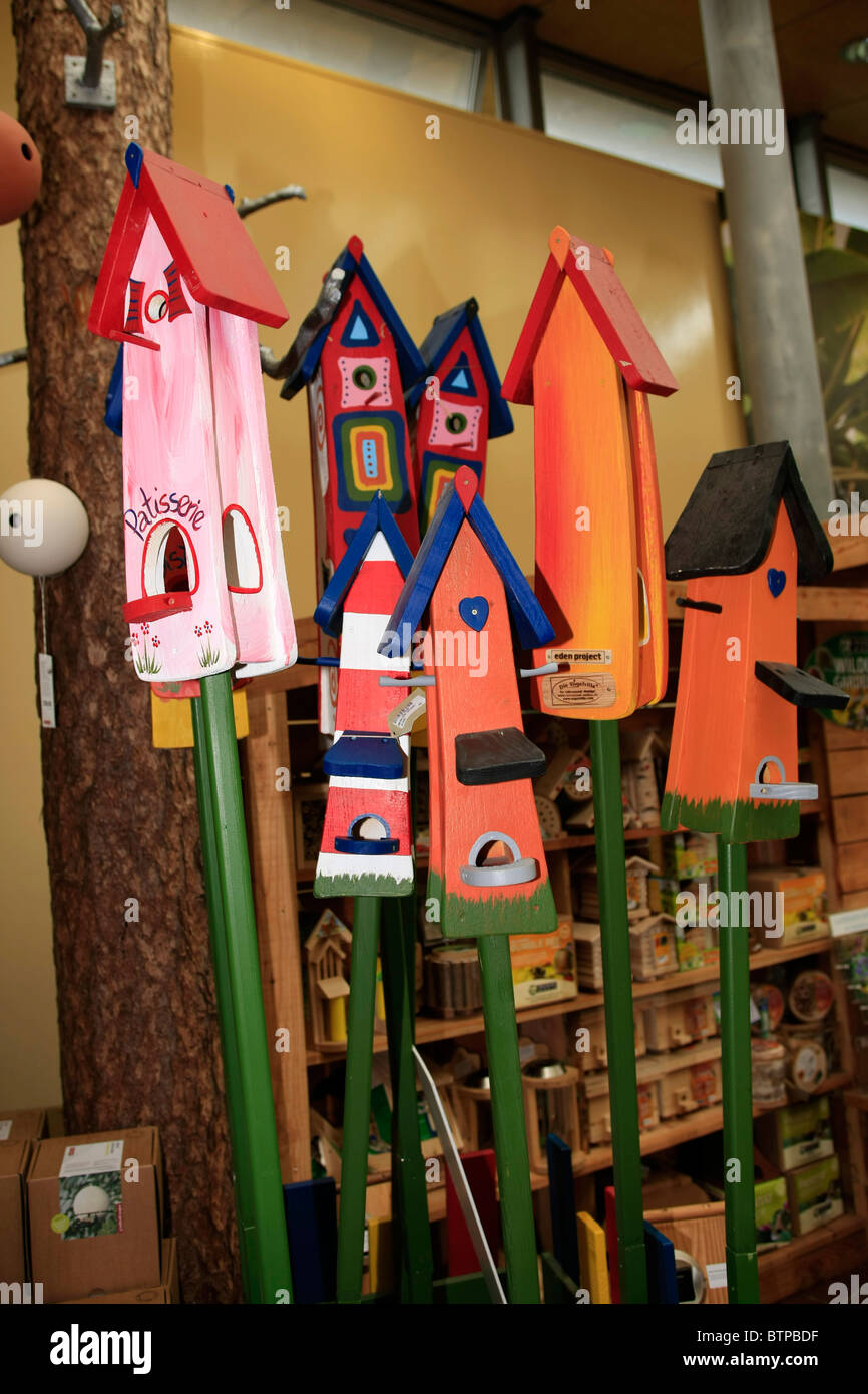 Colourful new bird houses for sale at a Gardening store Stock Photo - Alamy