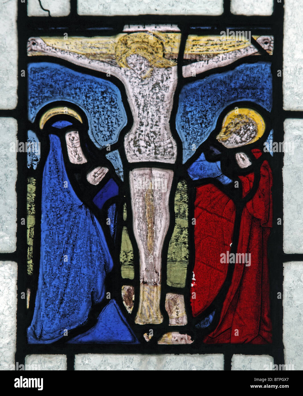 A 15th century medieval stained glass window depicting The Crucixion ...