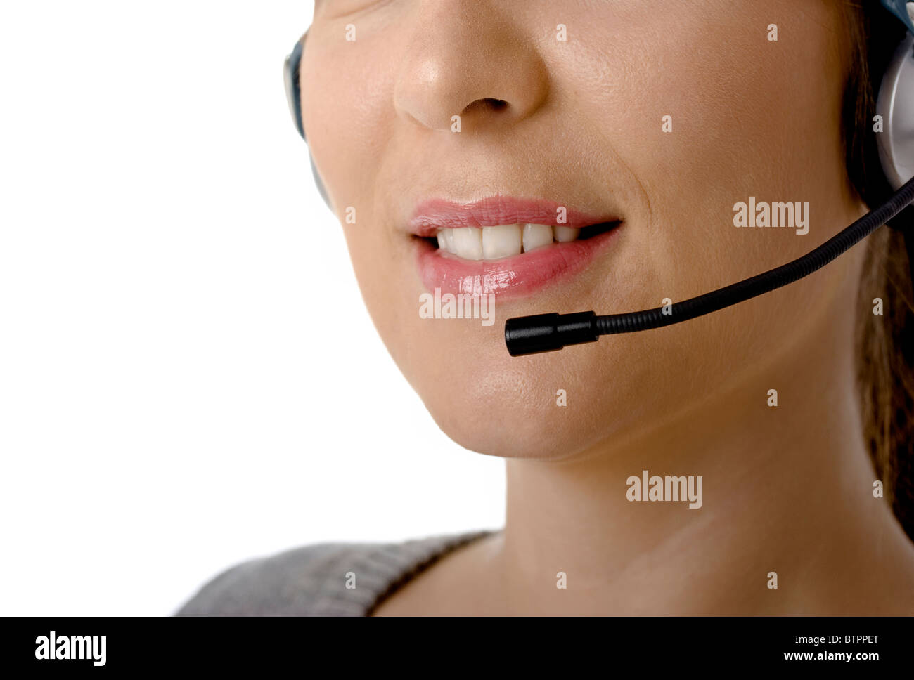 Close-up of an attractive business woman with headset Stock Photo - Alamy