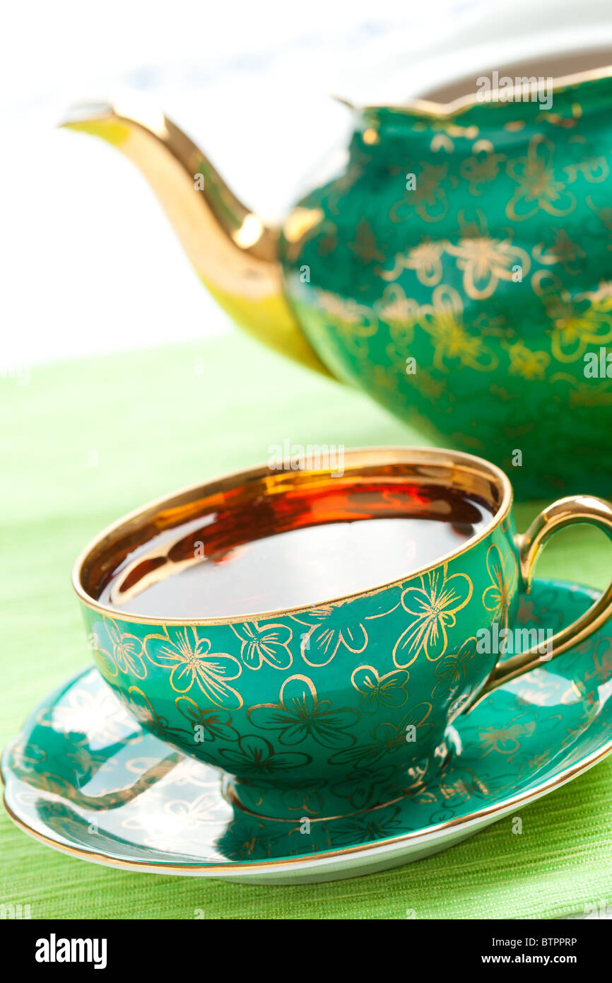 the tea in antique porcelain mug Stock Photo - Alamy
