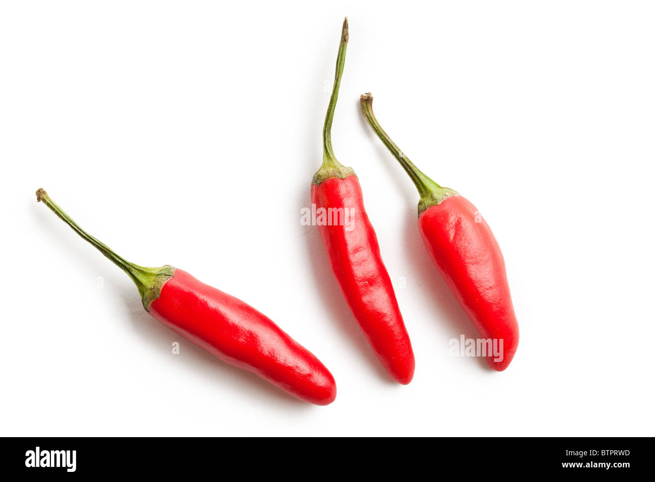 red hot peppers on white background Stock Photo - Alamy