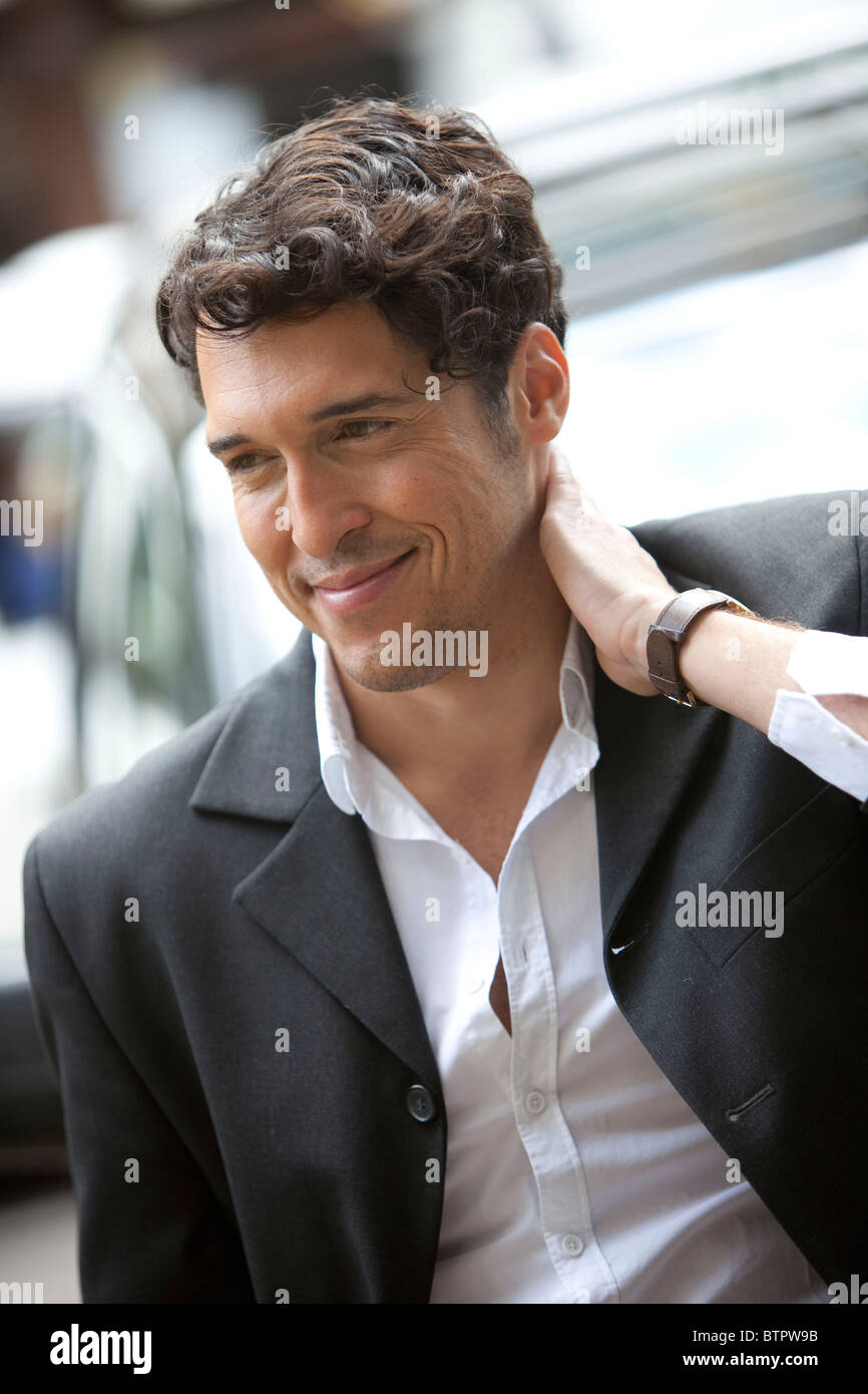 good looking man in a suit happy Stock Photo - Alamy