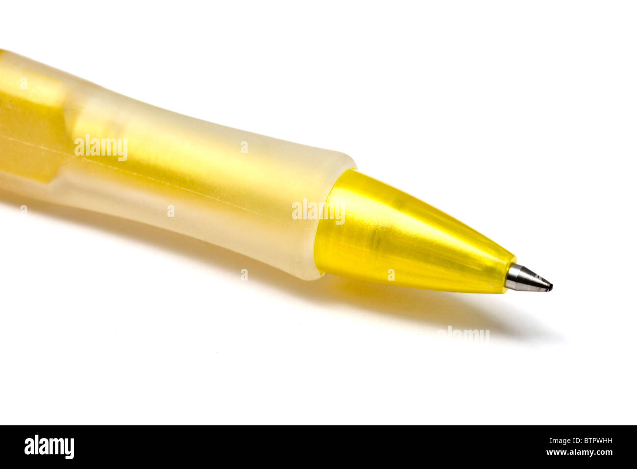 Yellow pen closeup on the white background Stock Photo - Alamy