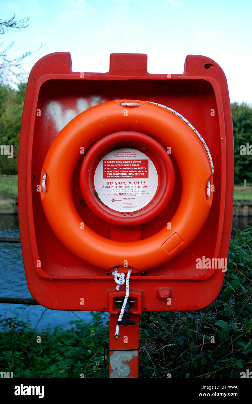 lifebuoy at side of river england uk Stock Photo - Alamy