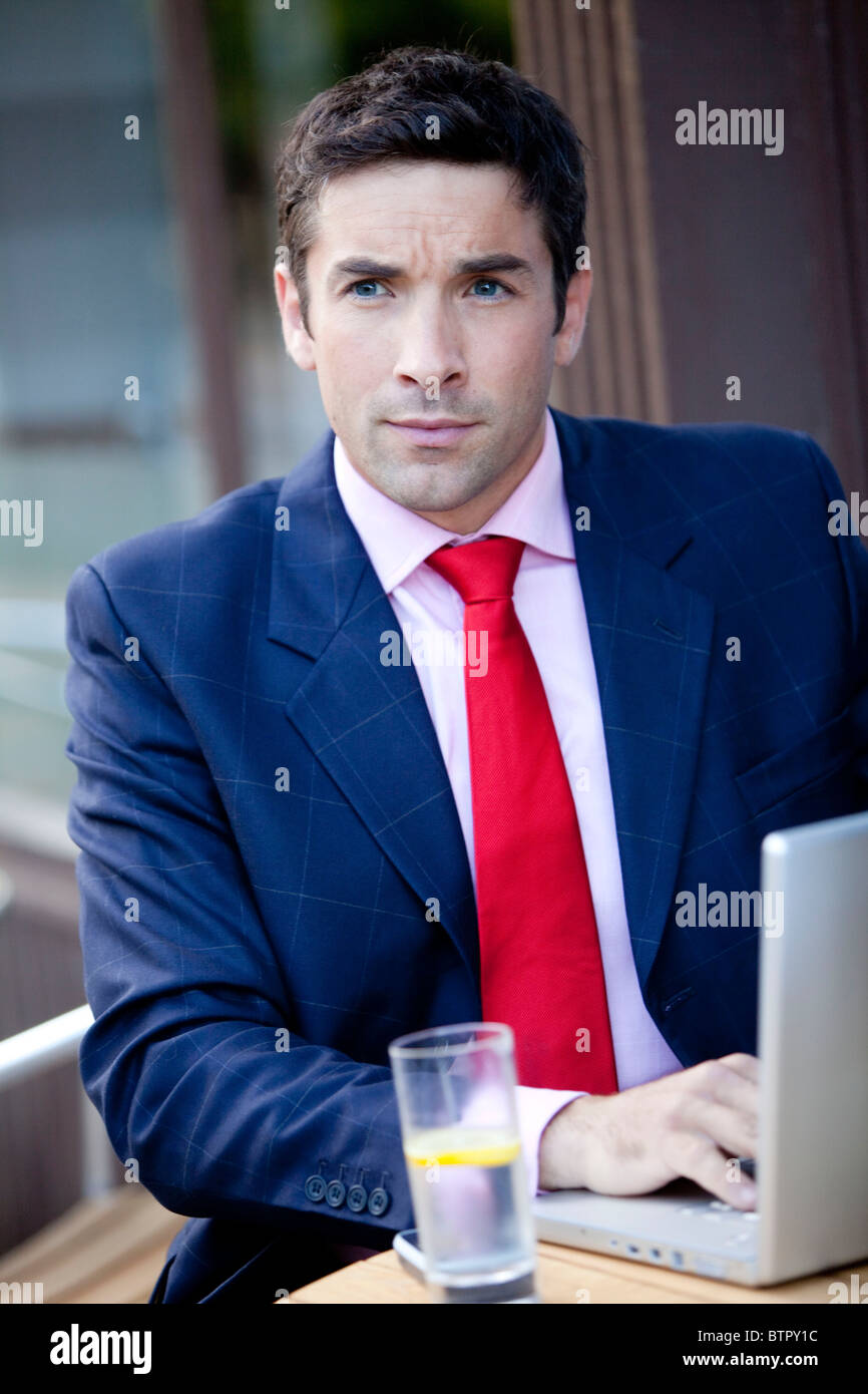 man in a smart suit at laptop Stock Photo - Alamy