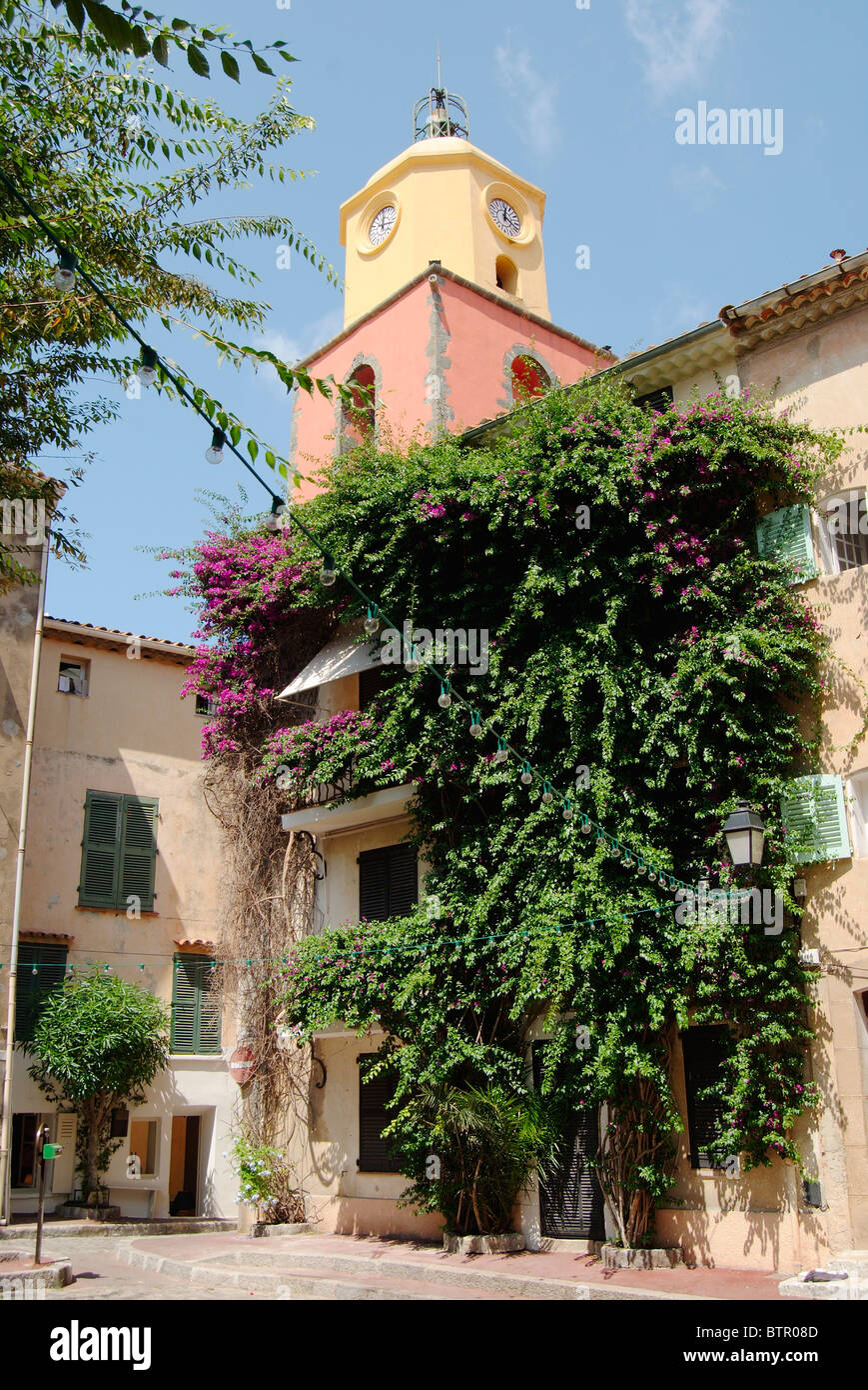 France, Saint-Tropez, View of creeper growing outside clock tower Stock ...