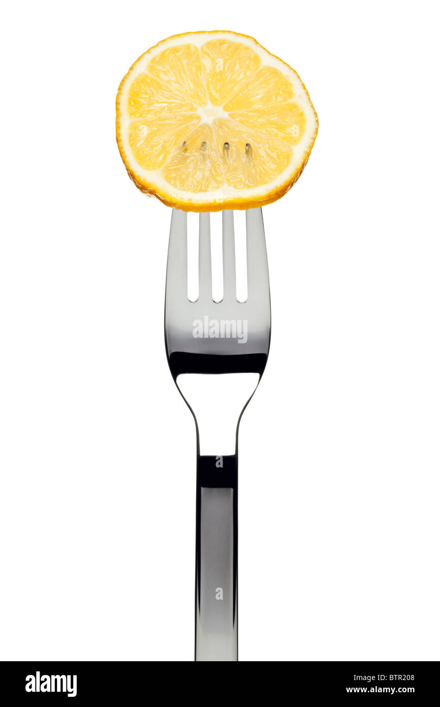 lemon slice sticking on a fork, cutout Stock Photo - Alamy