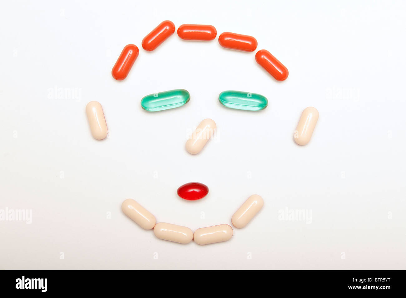 medication and pills face on gray background Stock Photo - Alamy