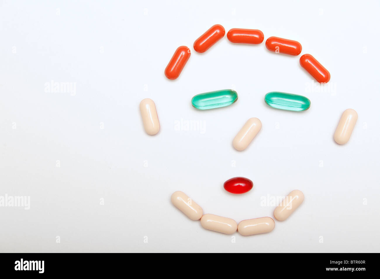 medication and pills face on gray background Stock Photo - Alamy