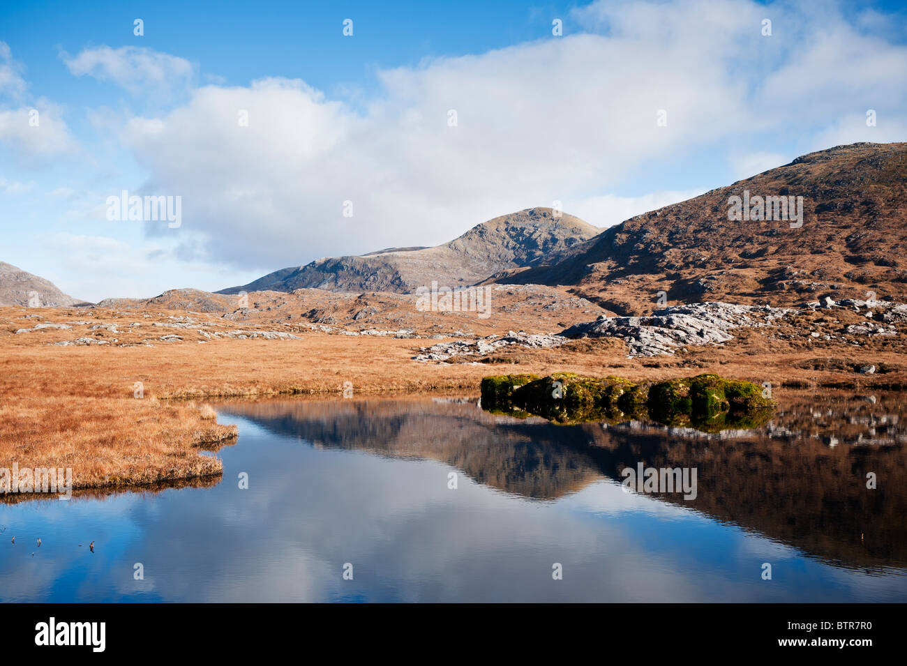 Small tarn with mountain reflection, Isle of Harris, Outer Hebrides ...