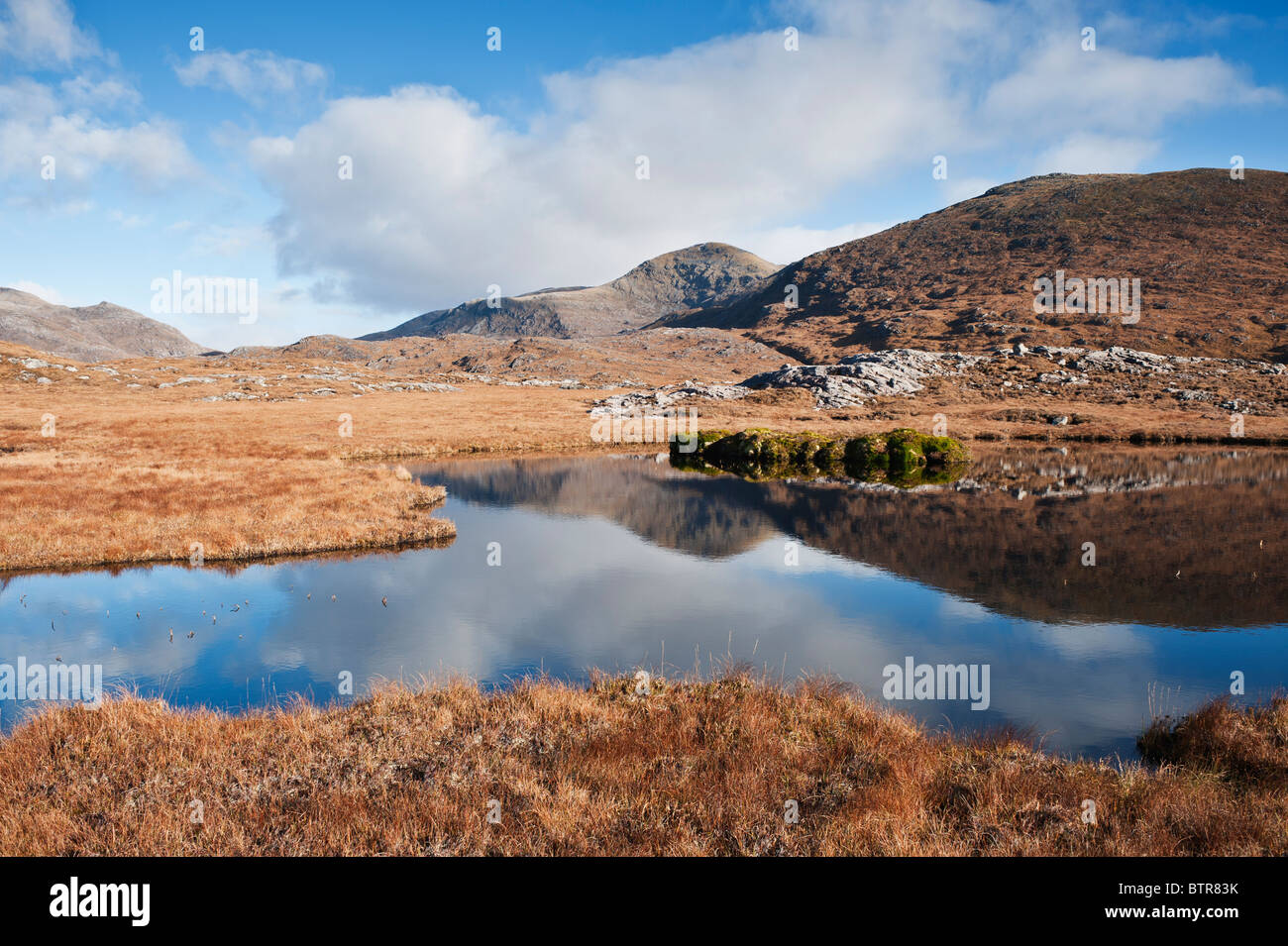 Small tarn with mountain reflection, Isle of Harris, Outer Hebrides ...
