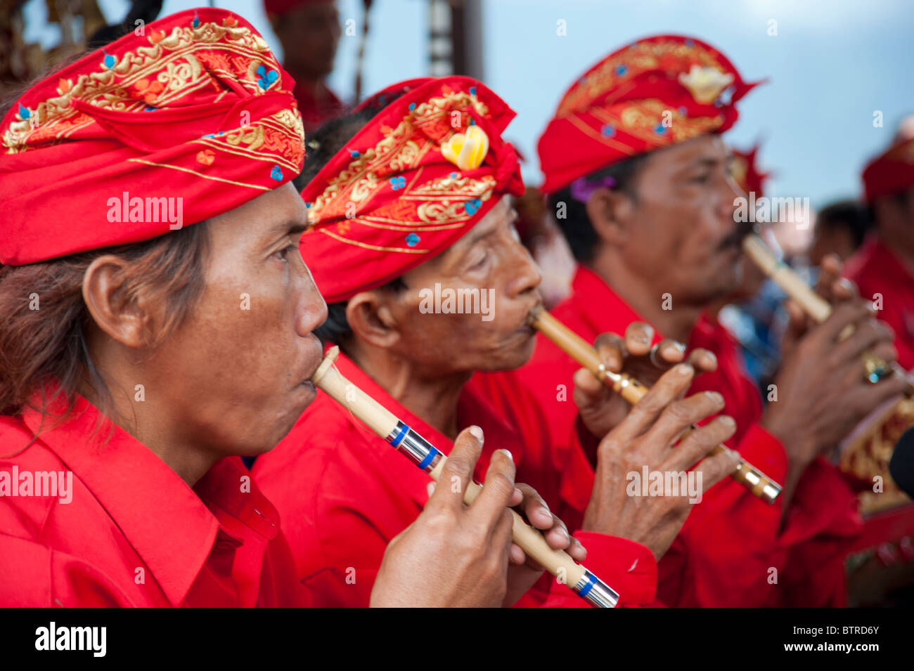 Balinese Gamelan musicians playing their instruments in Bali wearing ...