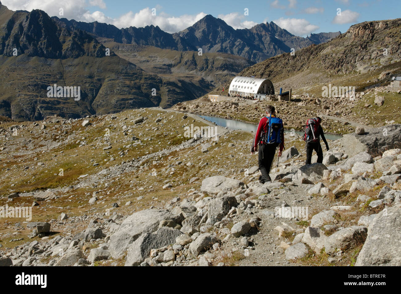 Walkers approaching the Vittorio Emanuele hut in the Gran Paradiso ...