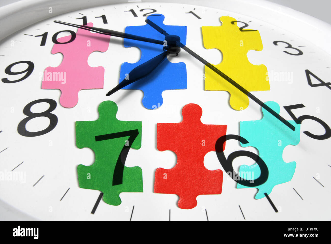 Clock and Jigsaw Puzzle Pieces Stock Photo - Alamy