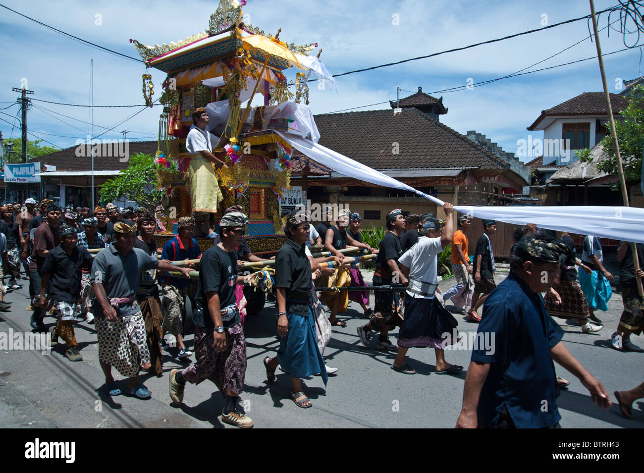 Funeral procession making way down street in Bualu, Nusa Dua, Bali ...
