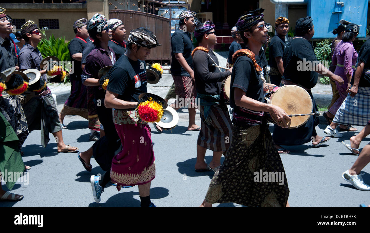 Funeral procession making way down street in Bualu, Nusa Dua, Bali ...
