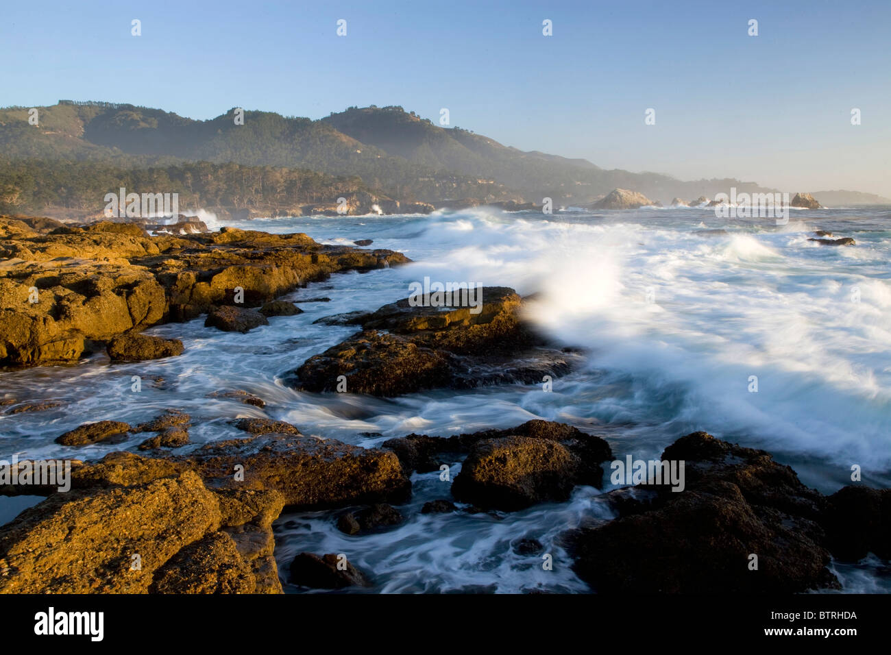 Waves crash along the shore at Point Lobos State Park, California Stock ...