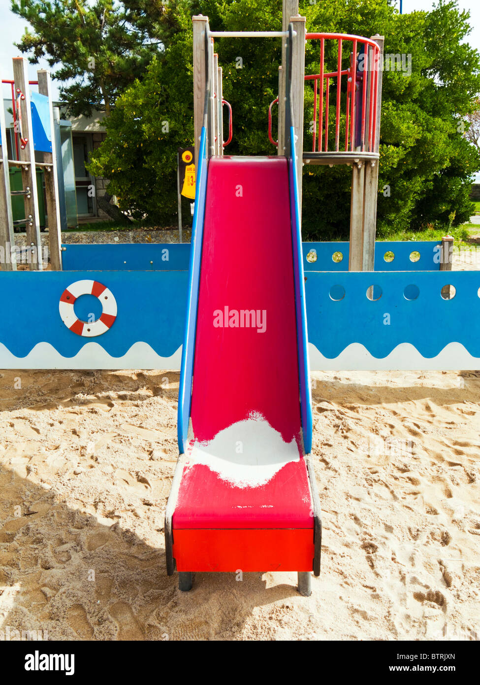 Childrens playground slides sand hi-res stock photography and images ...