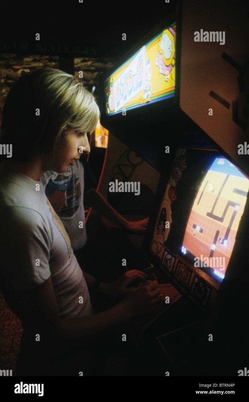 Lone teen male boy play video game challenge attention attentive ...