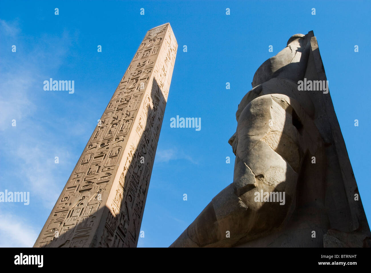 Statue of Ramses 2nd and the Obelisk, Luxor Temple, Luxor, Egypt Stock ...