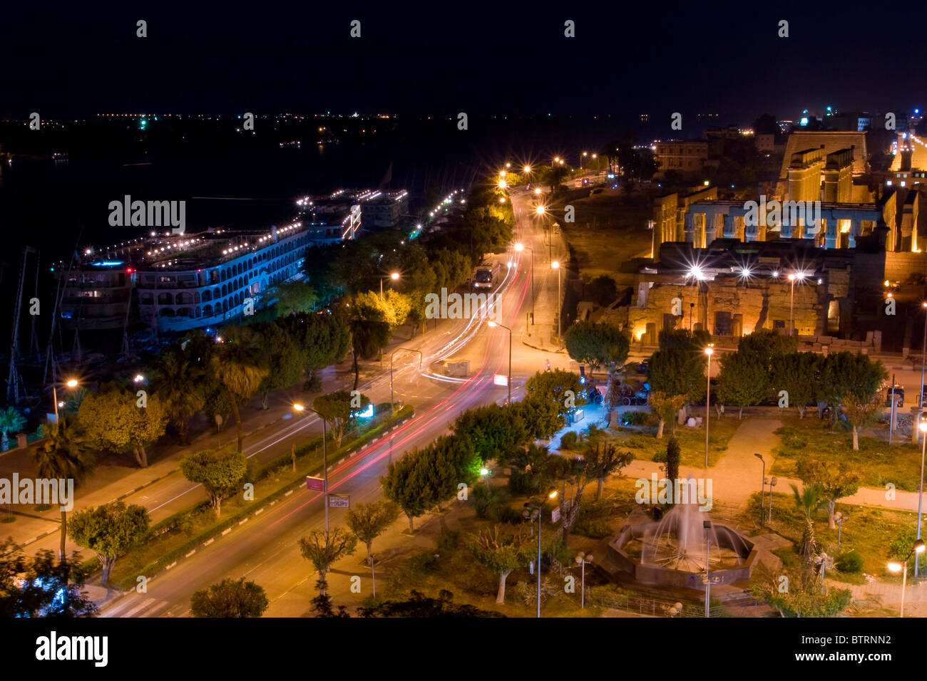 View of Luxor Temple, the Corniche el Nill and cruise boats on the ...