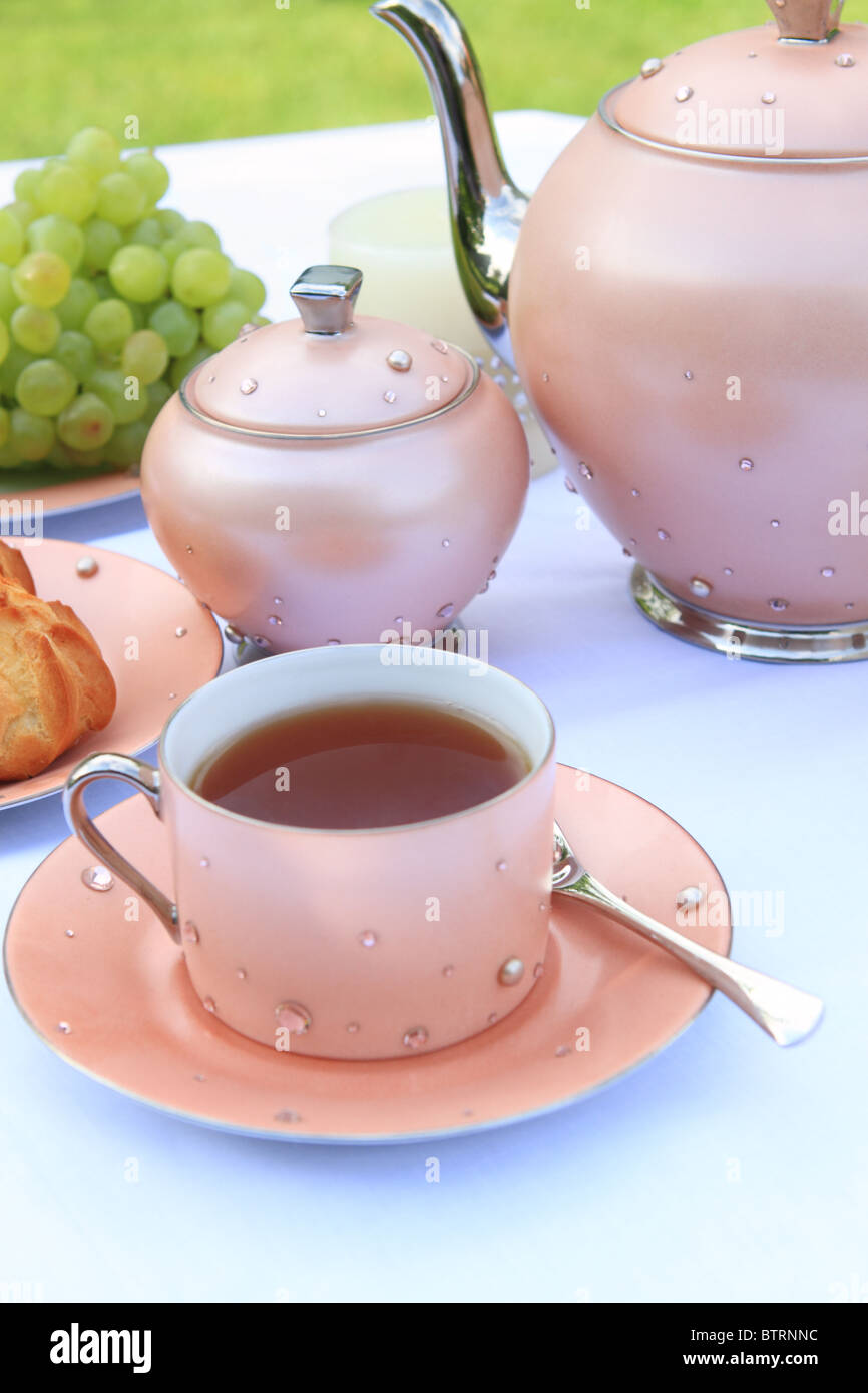 Table in the garden is served for tea Stock Photo - Alamy