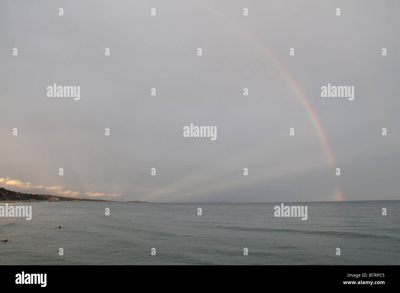Rainbow over sea Stock Photo - Alamy