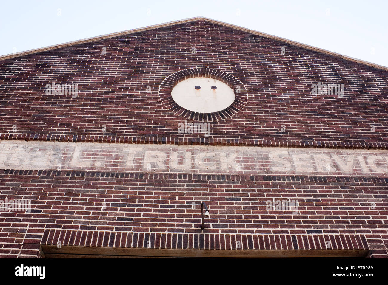 Brick wall with Company name Stock Photo - Alamy