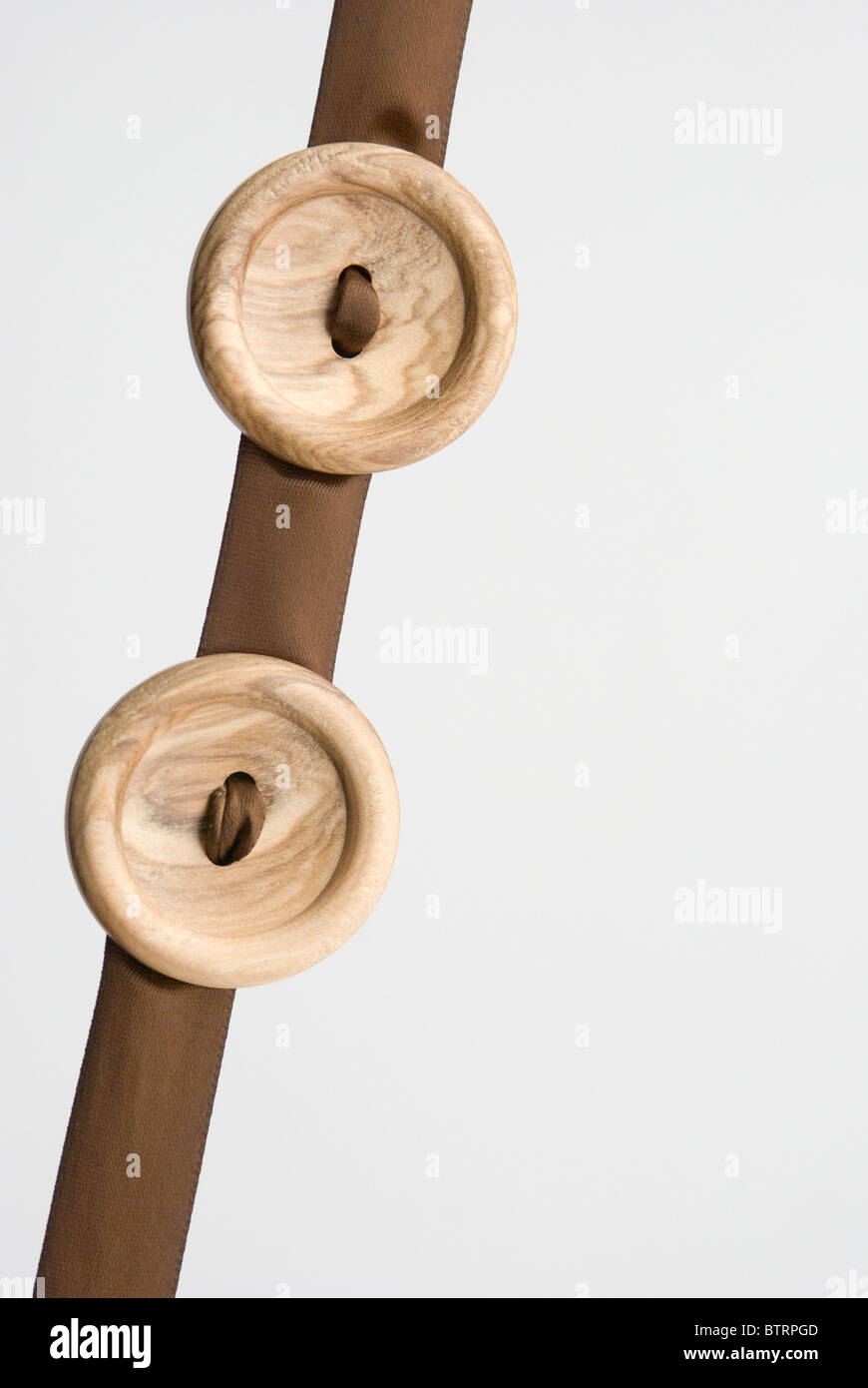 Wood buttons on ribbon Stock Photo - Alamy