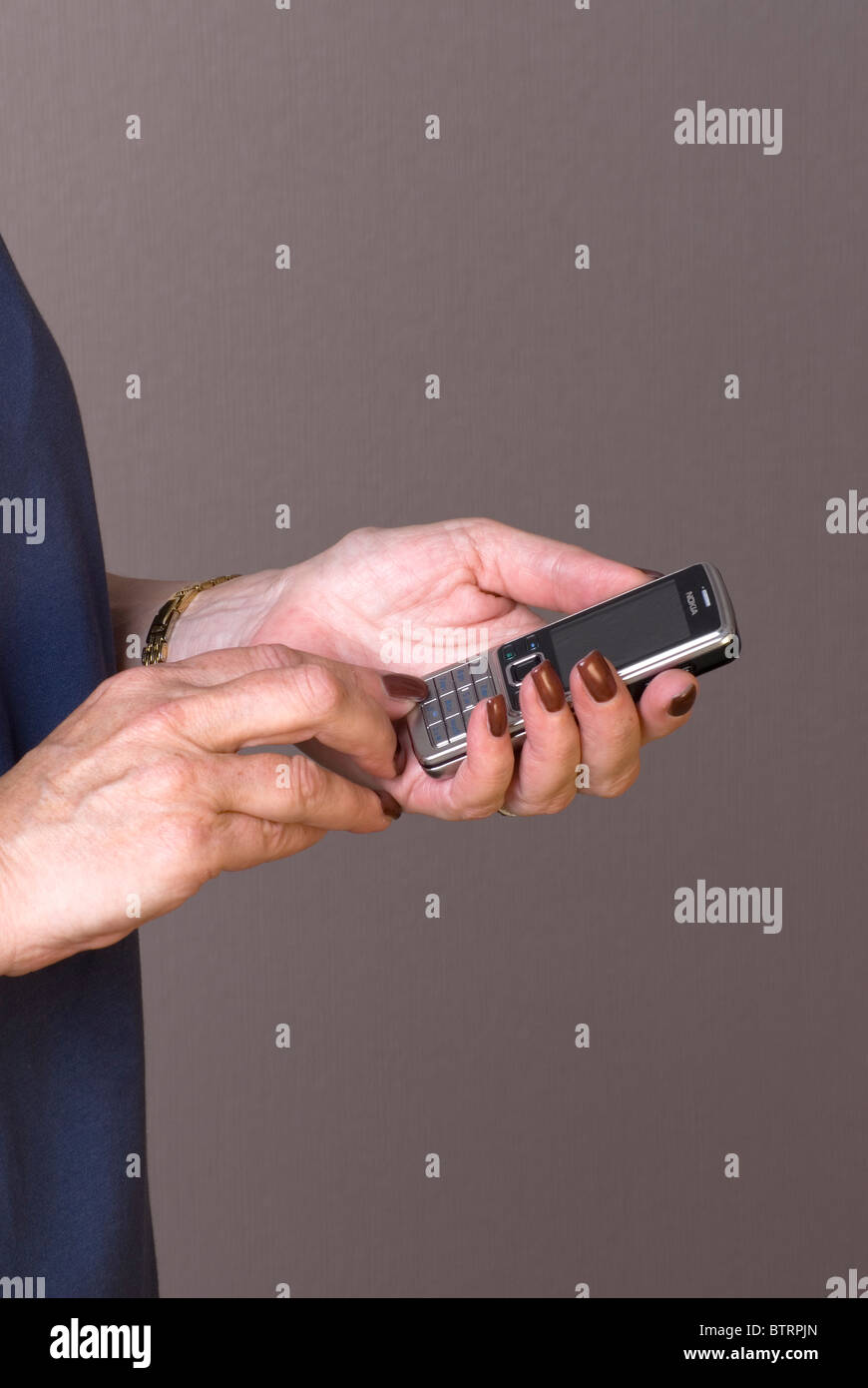 Oap using a mobile phone hi-res stock photography and images - Alamy